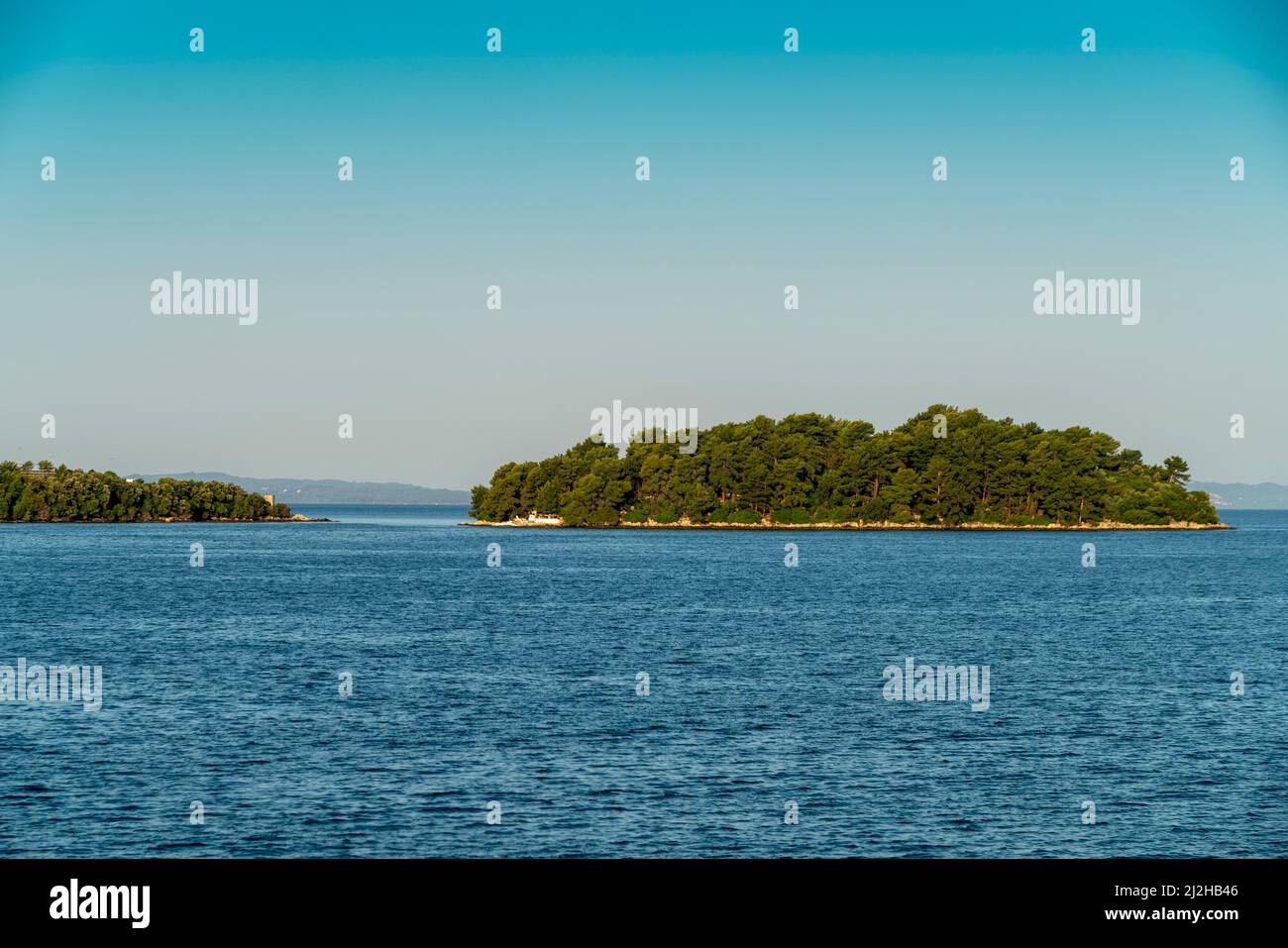 Greece, Igoumenitsa, Small green island in sea Stock Photo - Alamy