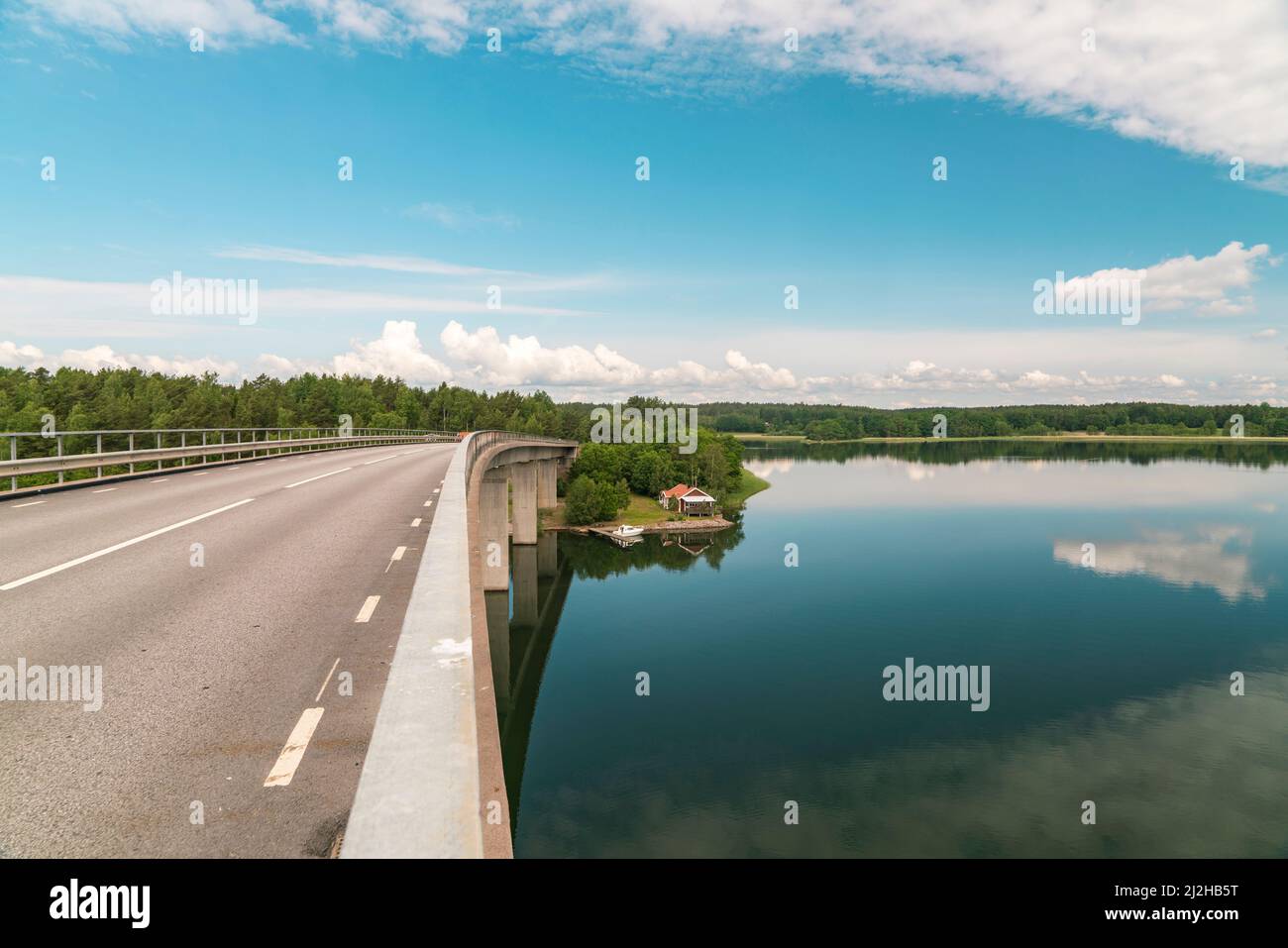 Sweden, Loftahammar, Empty coastal road and calm sea sky Stock Photo ...