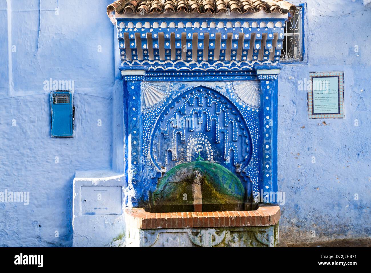 Morocco, Chefchaouen, Drinking fountain at traditional blue house Stock ...