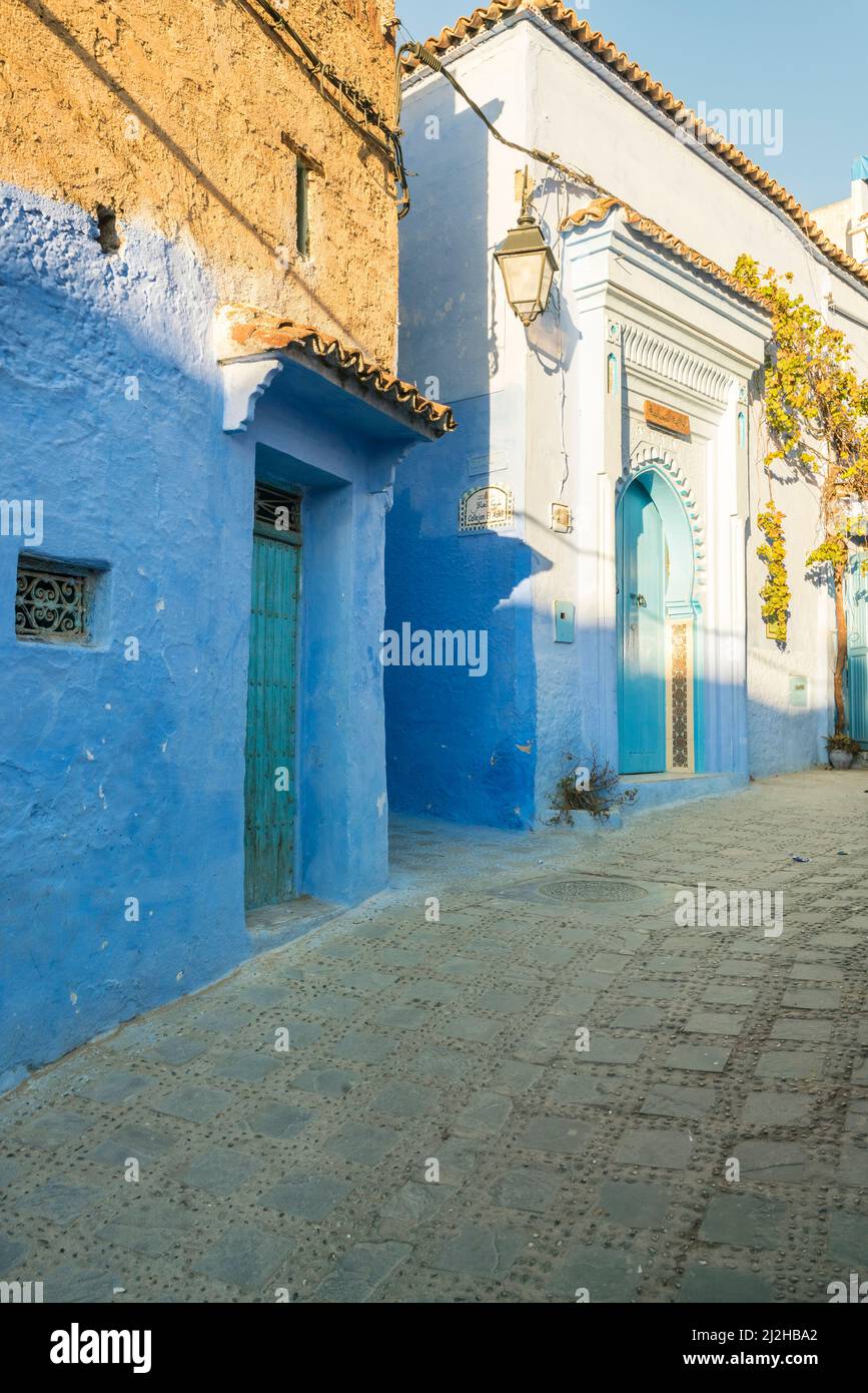 Morocco, Chefchaouen, Cobblestone alley and traditional blue houses ...