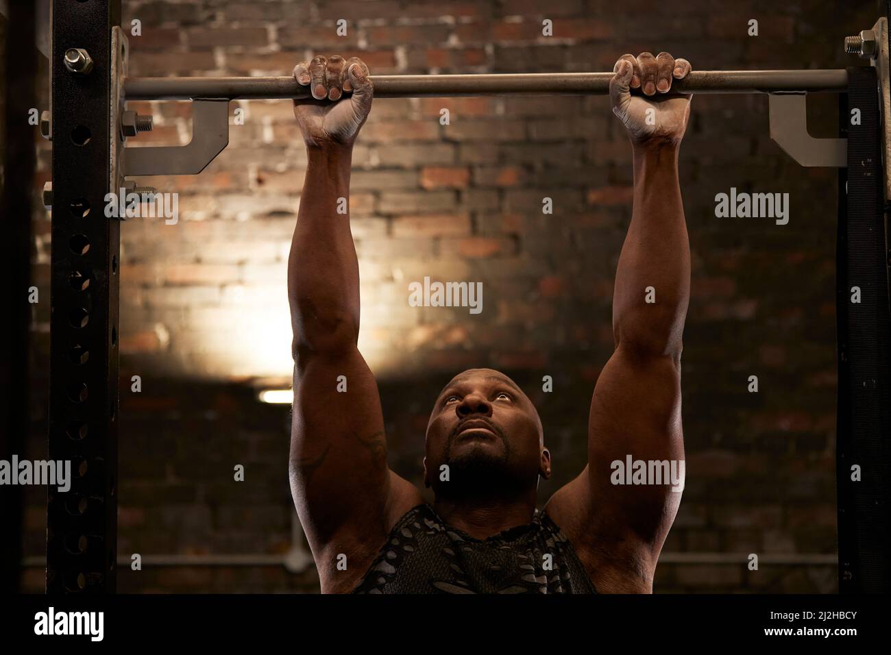 Muscular man exercising in gym Stock Photo - Alamy