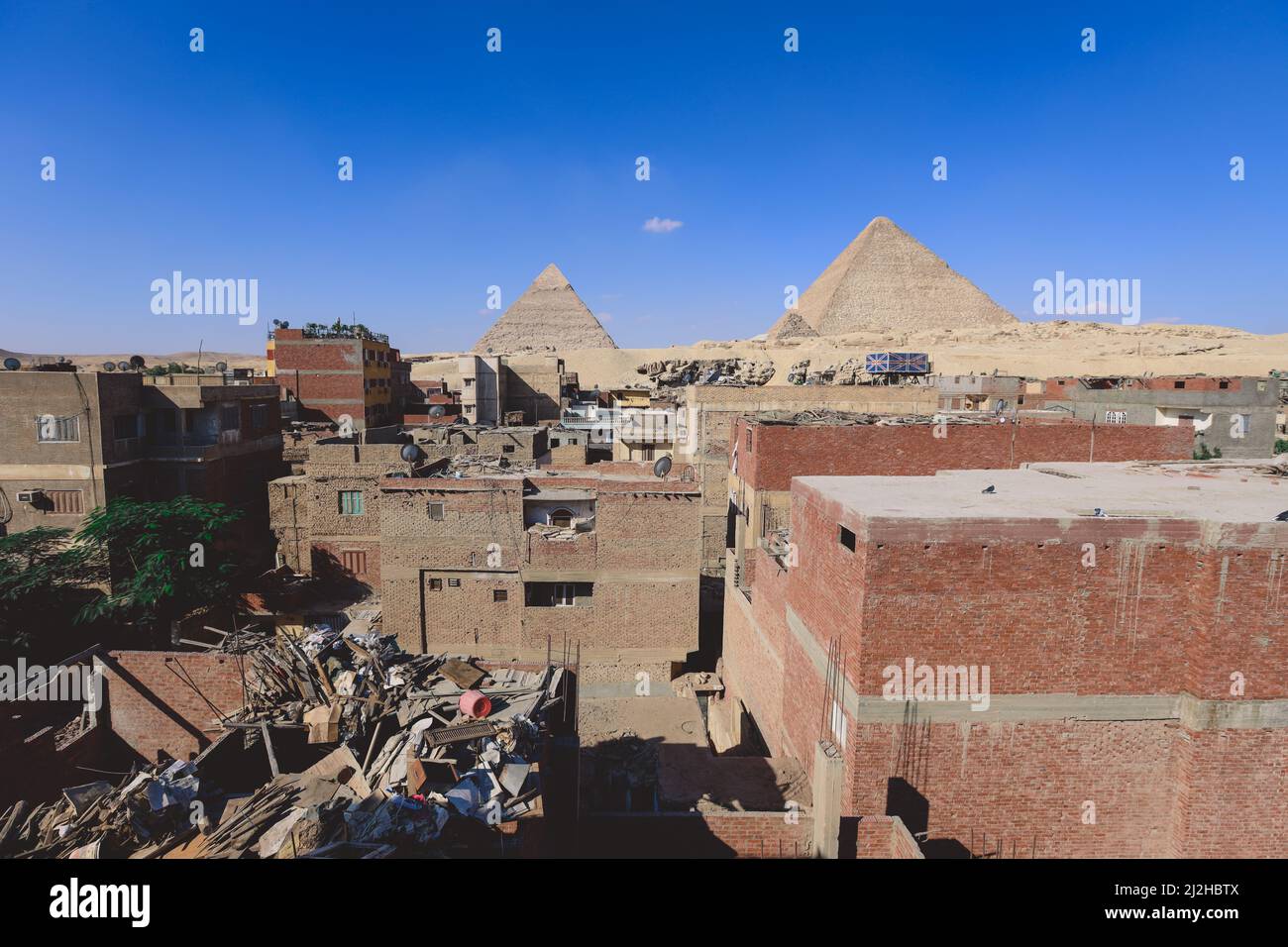 View of the Pyramids of Giza from the city Stock Photo - Alamy