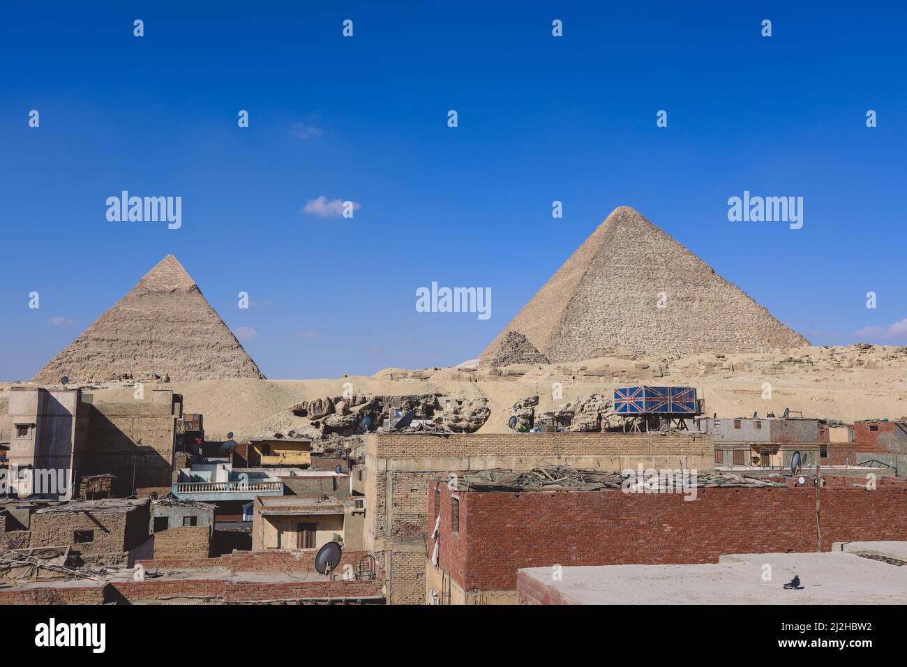 View of the Pyramids of Giza from the city Stock Photo - Alamy