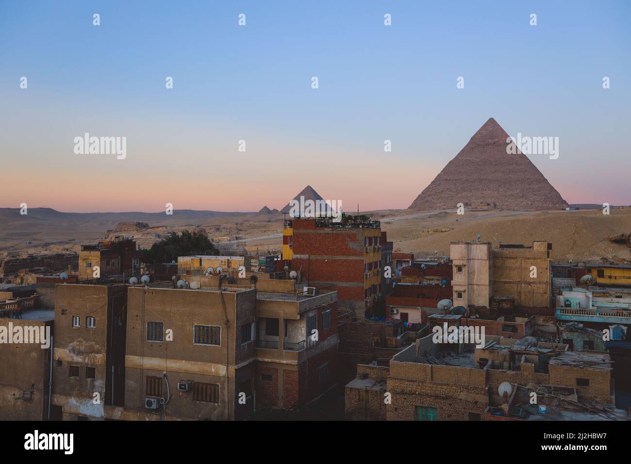View of the Pyramids of Giza from the city Stock Photo - Alamy