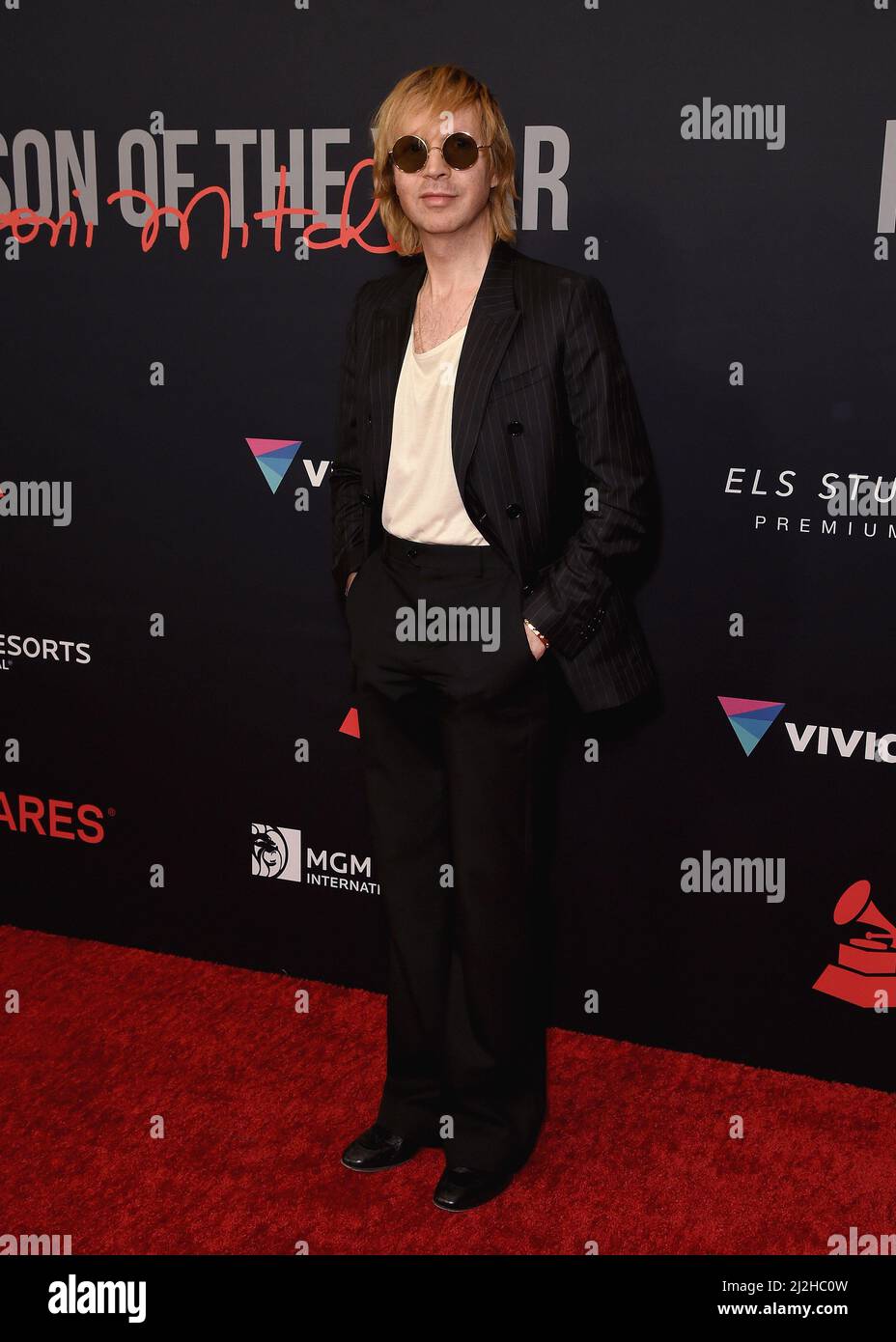 Beck walking on the red carpet at the 31st Annual MusiCares Person of ...