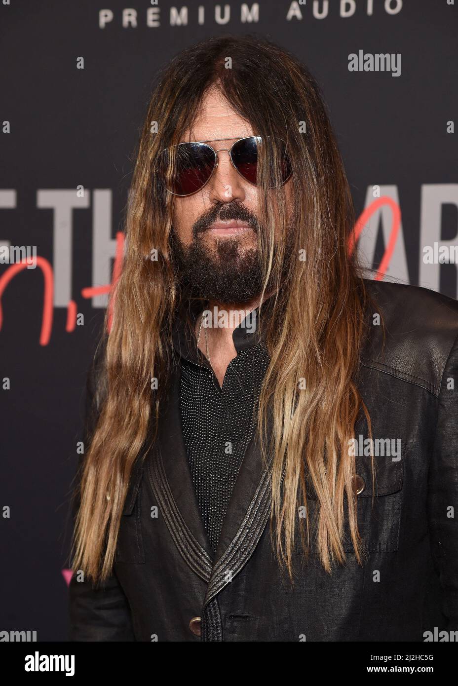 Billy Ray Cyrus walking on the red carpet at the 31st Annual MusiCares ...