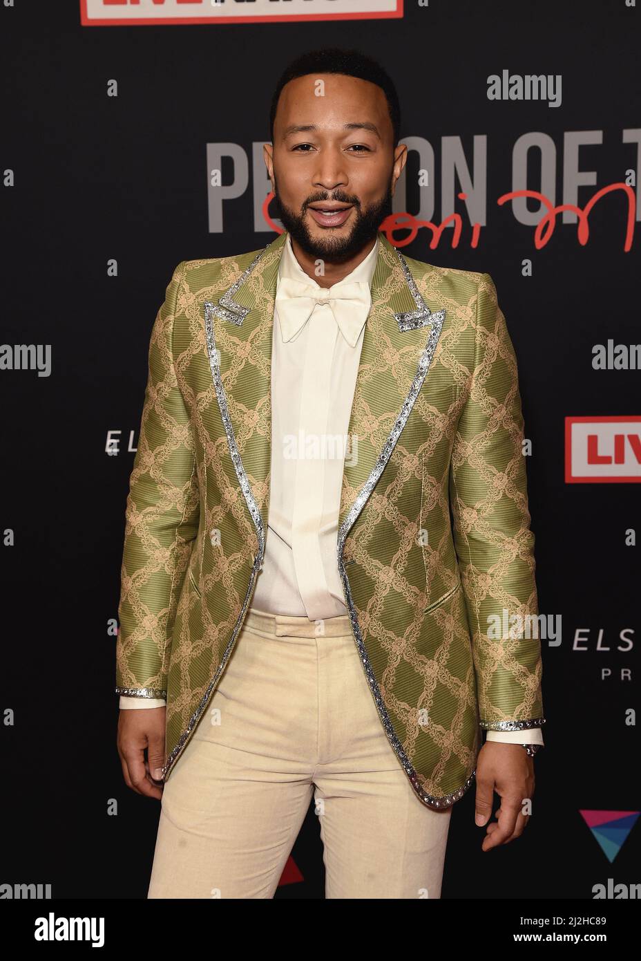 John Legend walking on the red carpet at the 31st Annual MusiCares ...