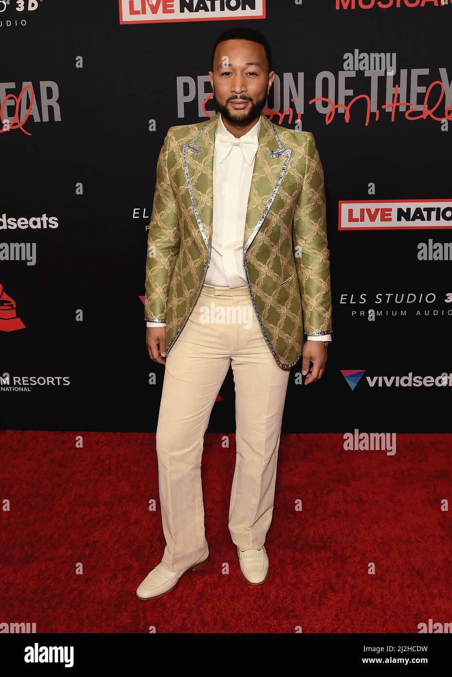 John Legend walking on the red carpet at the 31st Annual MusiCares ...