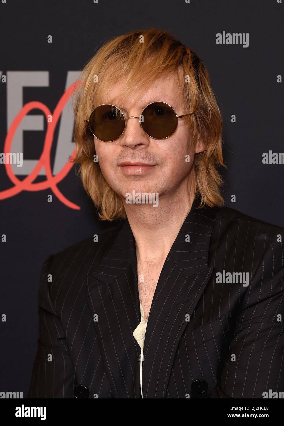 Beck walking on the red carpet at the 31st Annual MusiCares Person of ...