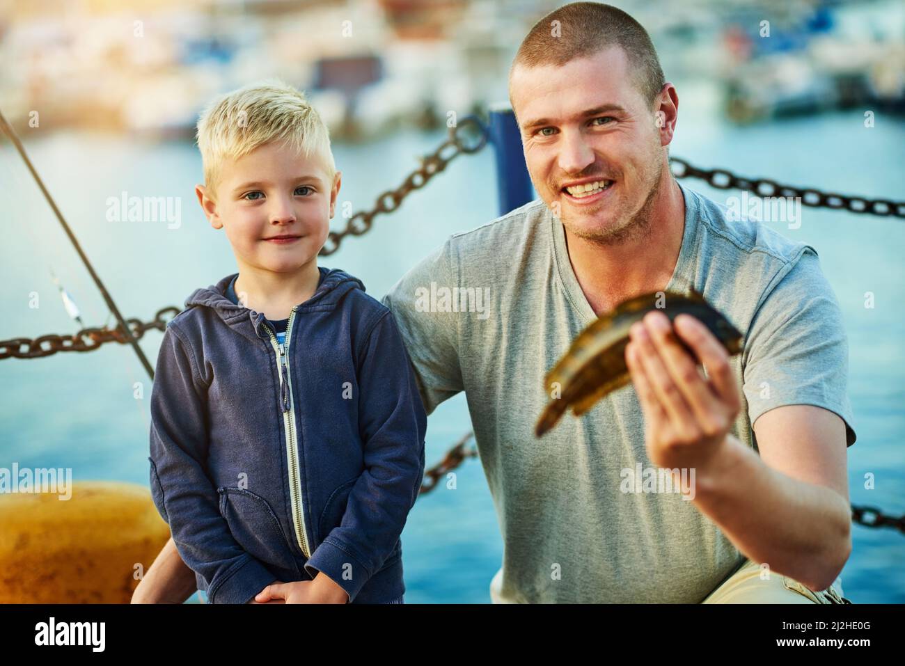 Catching their own dinner. Portrait of a father and his little boy ...
