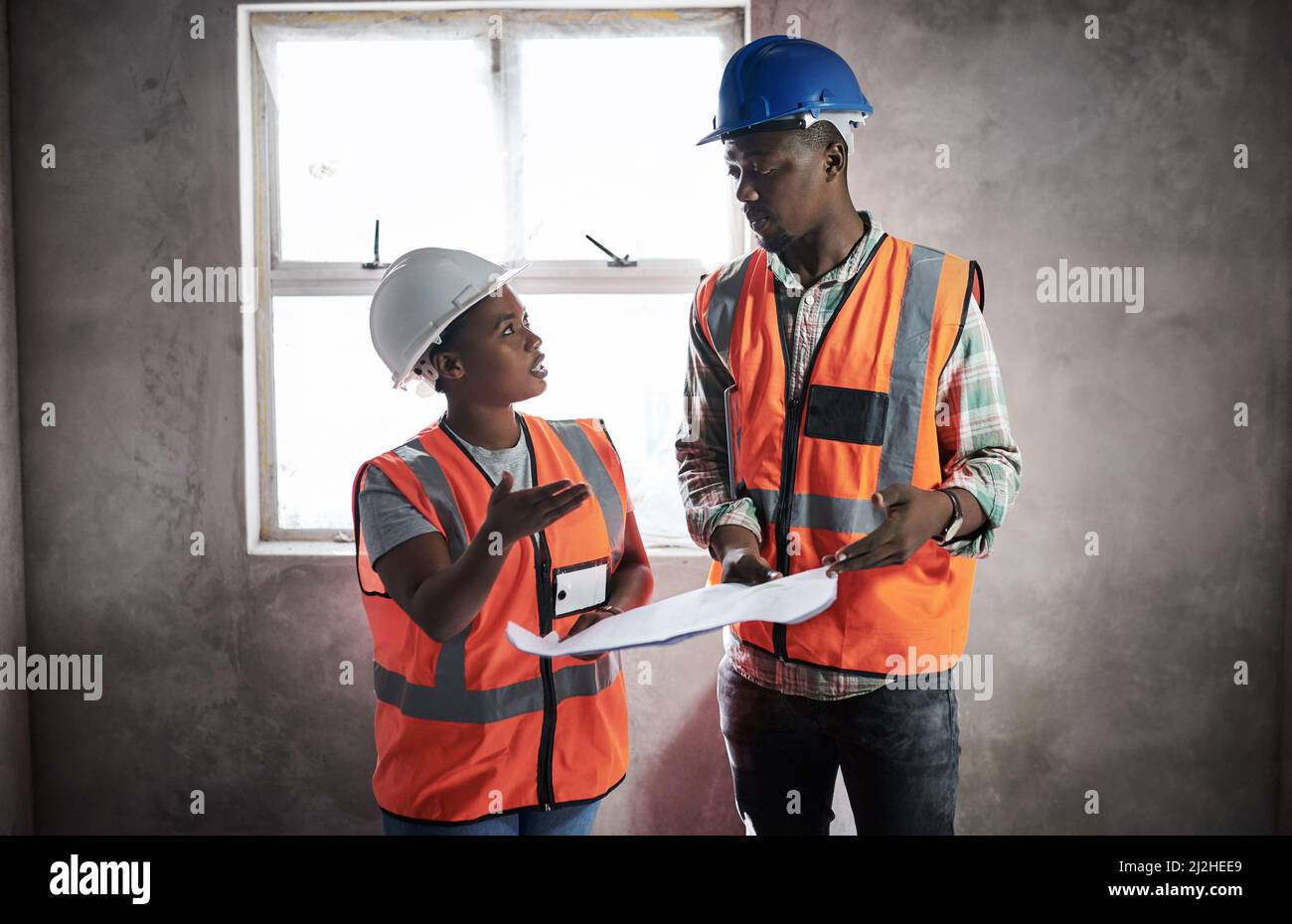 Plan, create, construct. Shot of a young man and woman going over ...