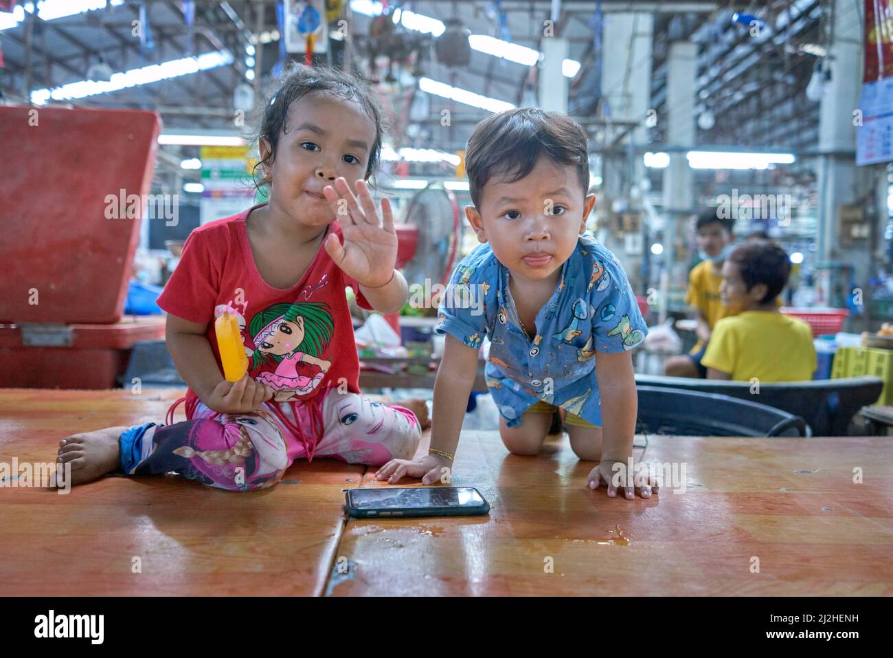 Thailand children playing together at in indoor market Stock Photo - Alamy