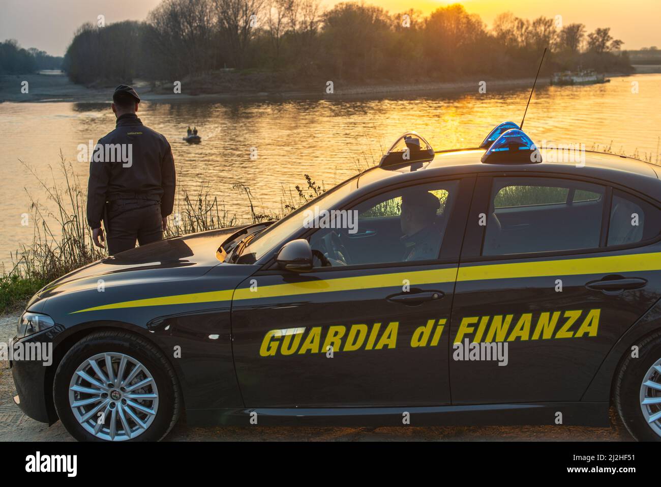 IRS tax evasion police guardia di finanza at sunset in the coast of ...