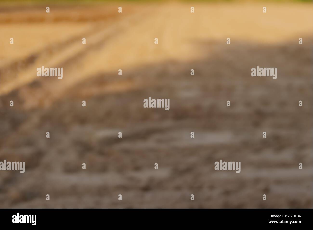 defocused background photo of empty farm field with natural shadow and ...