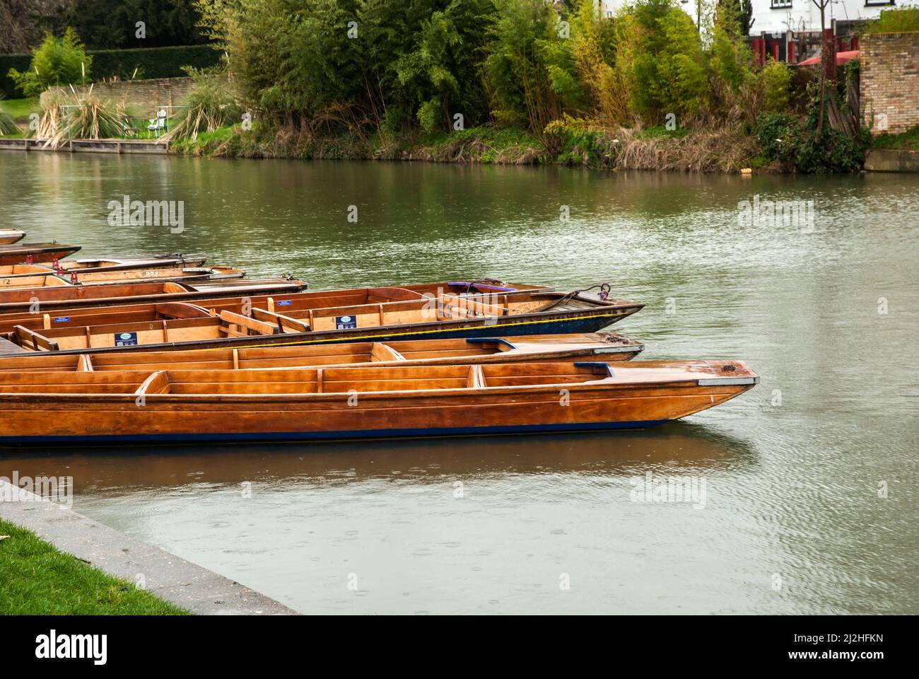 Punt flat bottom river wooden boats on river Cam waters in Cambridge ...