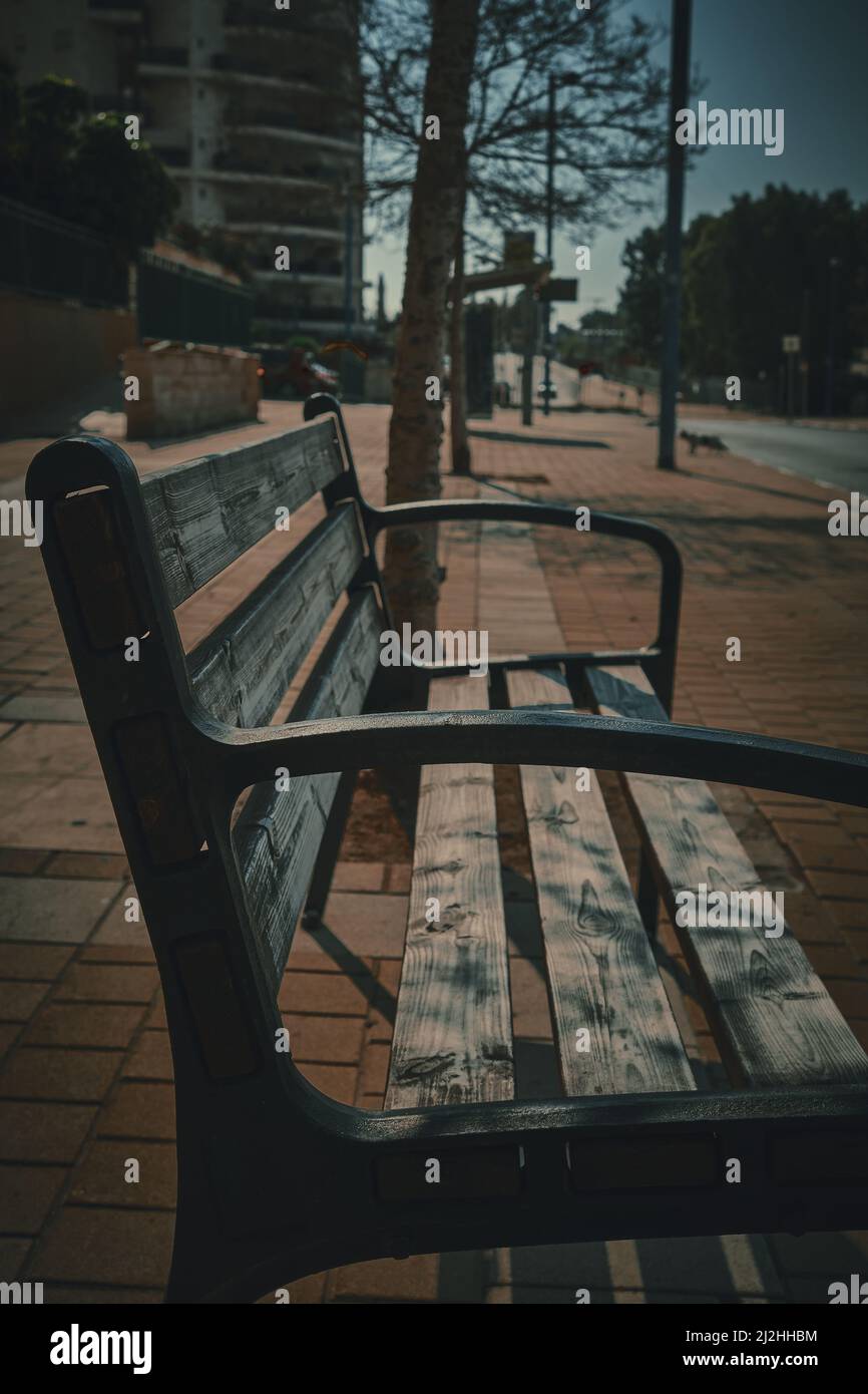 a bench in the street Stock Photo - Alamy