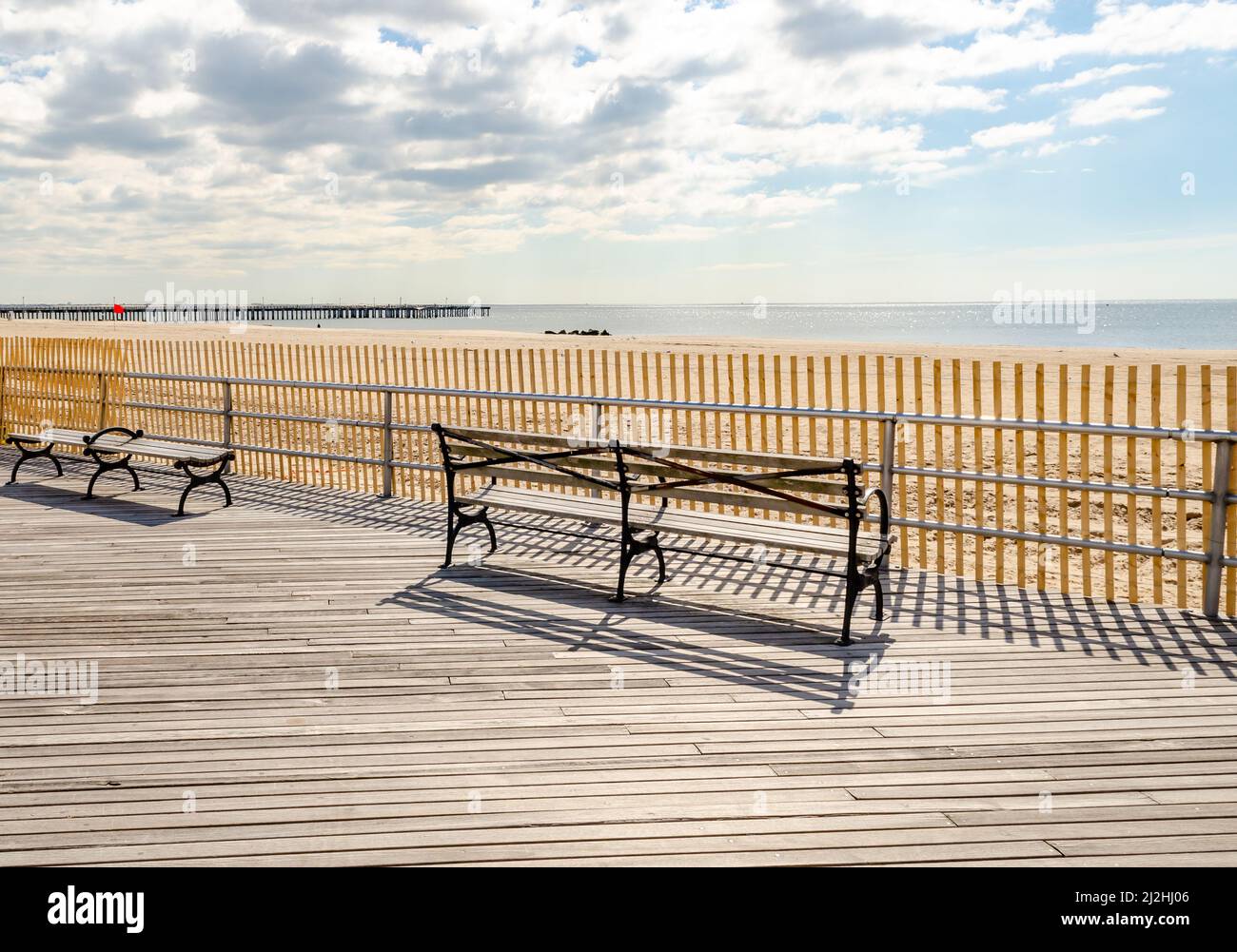 Benches at Coney island Beach Promenade, rear view, with Ocean and Pat ...