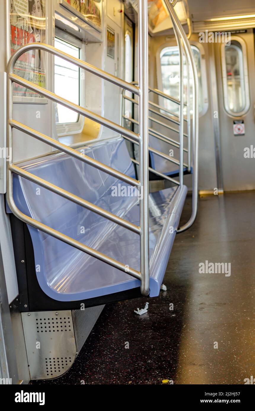 Empty blue Benches in Subway New York City, view from the side, driving ...