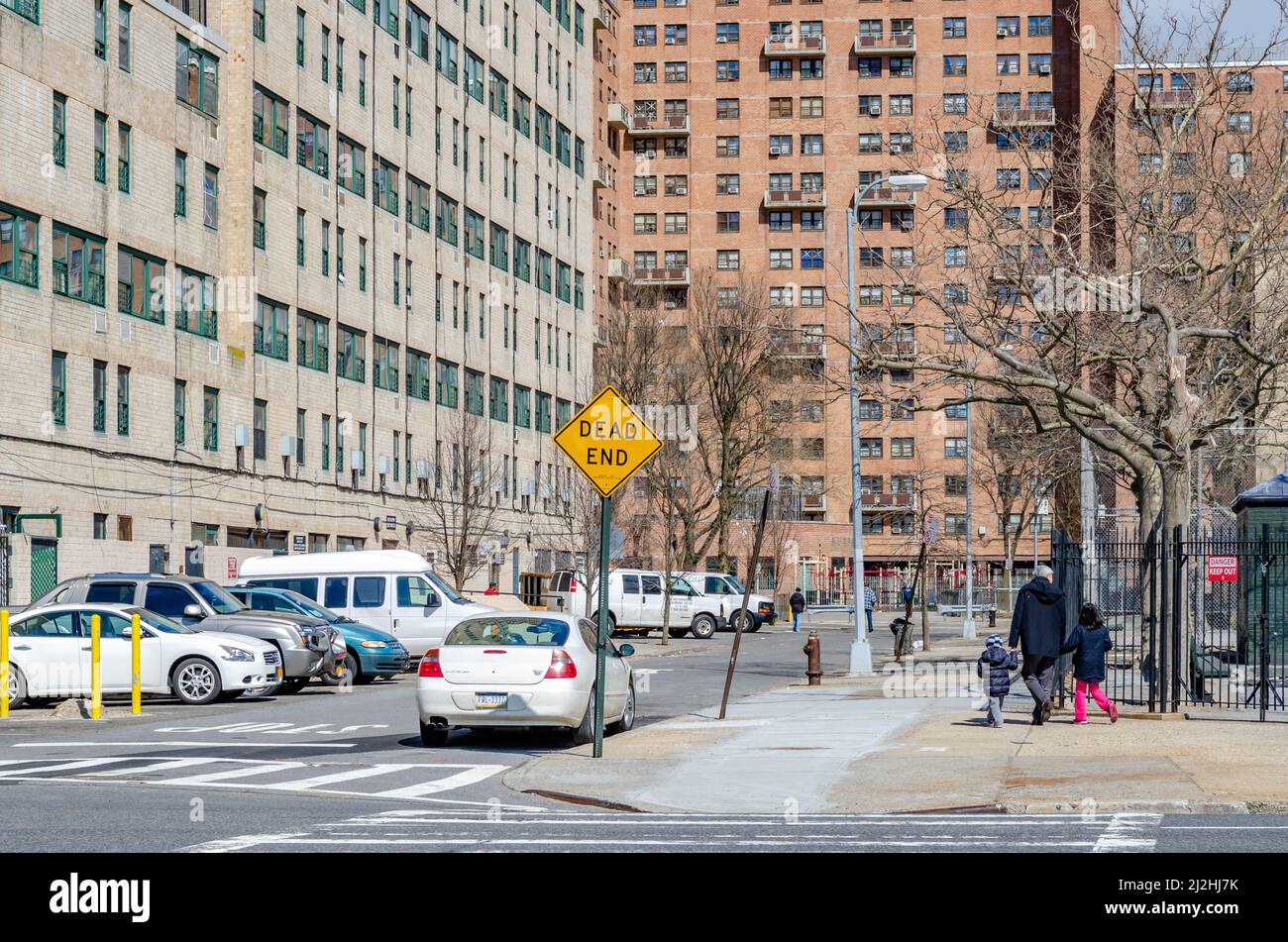 City Street with parked cars and yellow Dead End Sign at Coney Island ...