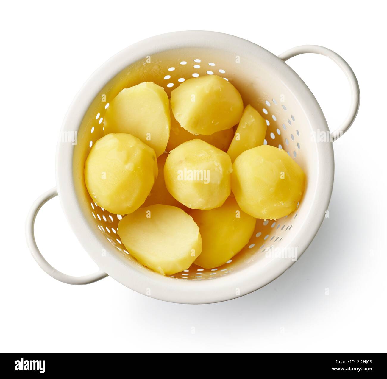 boiled potatoes in strainer isolated on white background, top view ...