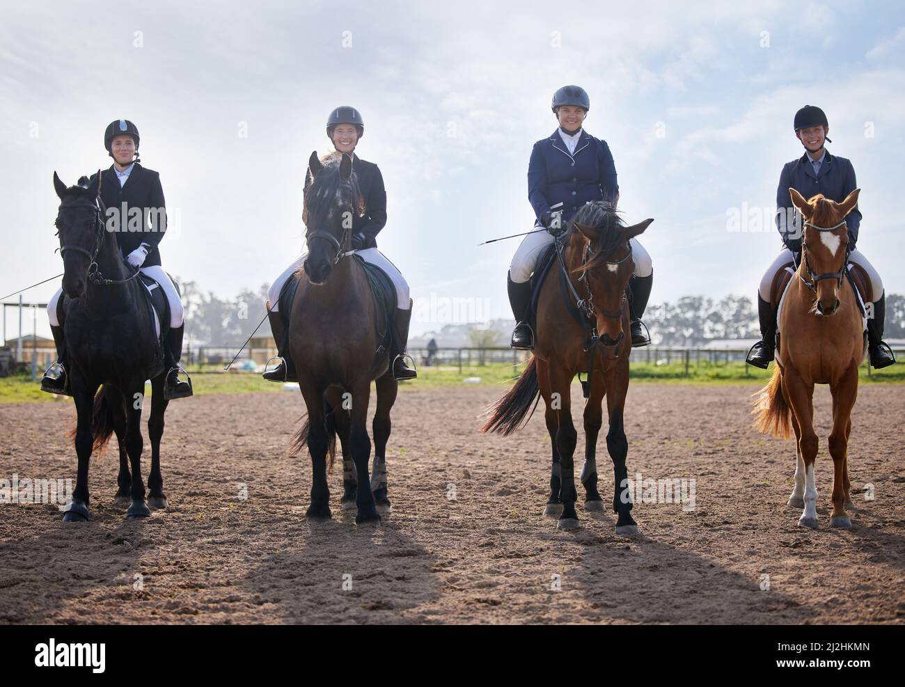 They share a love of horse riding. Full length shot of a group of ...
