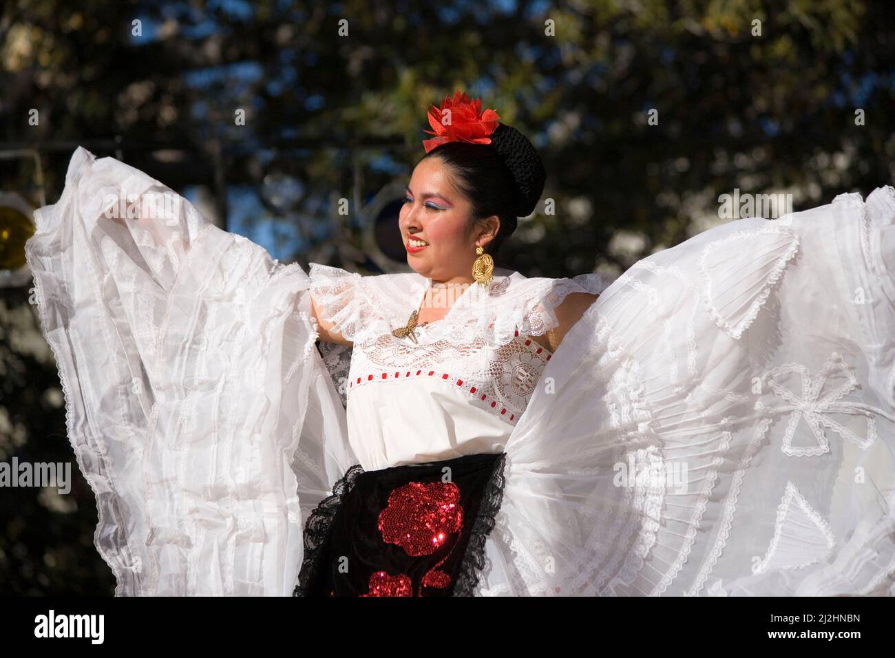 A dancer in traditional dress performing for Cinco de Mayo Stock Photo ...