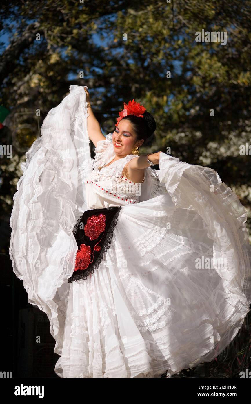 A dancer in traditional dress performing for Cinco de Mayo Stock Photo ...
