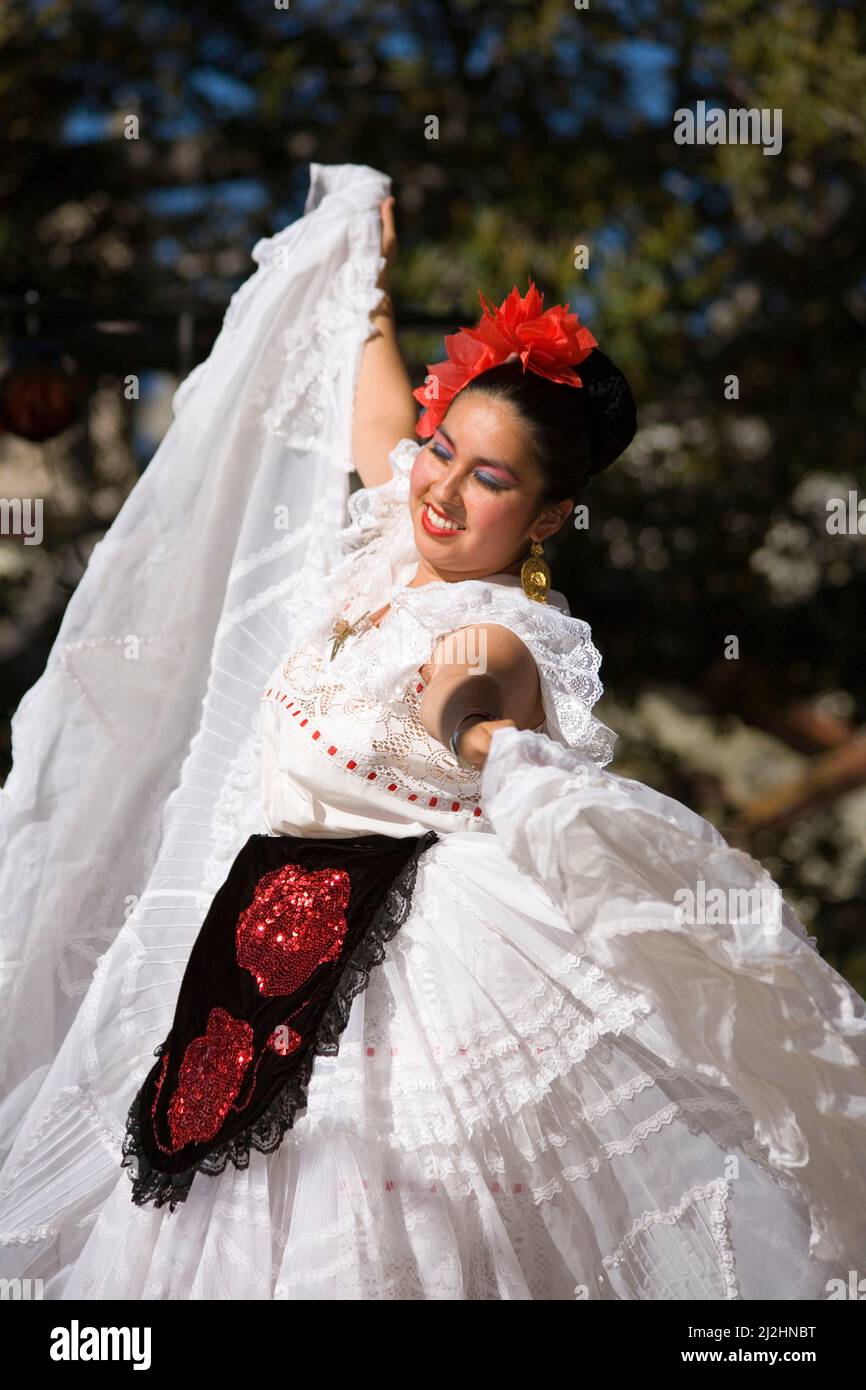 A dancer in traditional dress performing for Cinco de Mayo Stock Photo ...