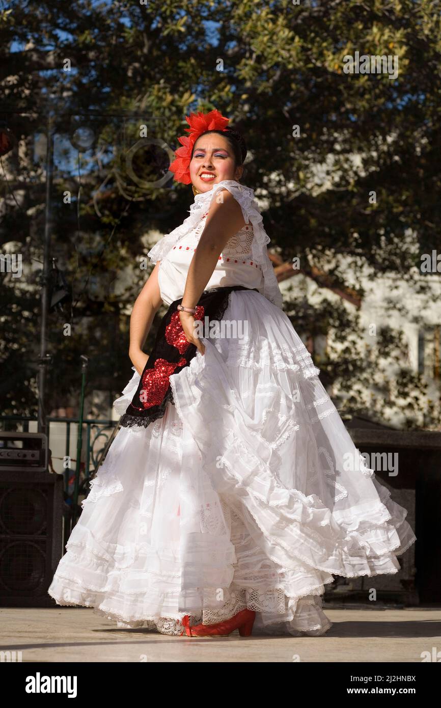 A dancer in traditional dress performing for Cinco de Mayo Stock Photo ...