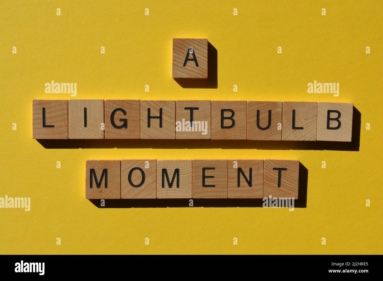 A Lightbulb Moment, words in wooden alphabet letters isolated on bright ...