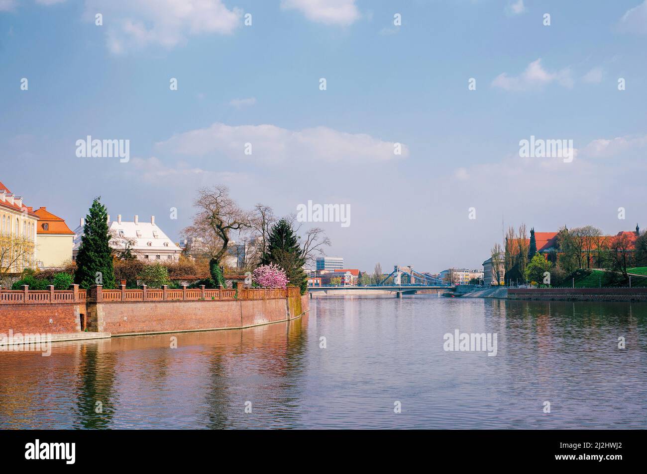 Quarantined city. Beautiful European cityscape with blue sky and river ...