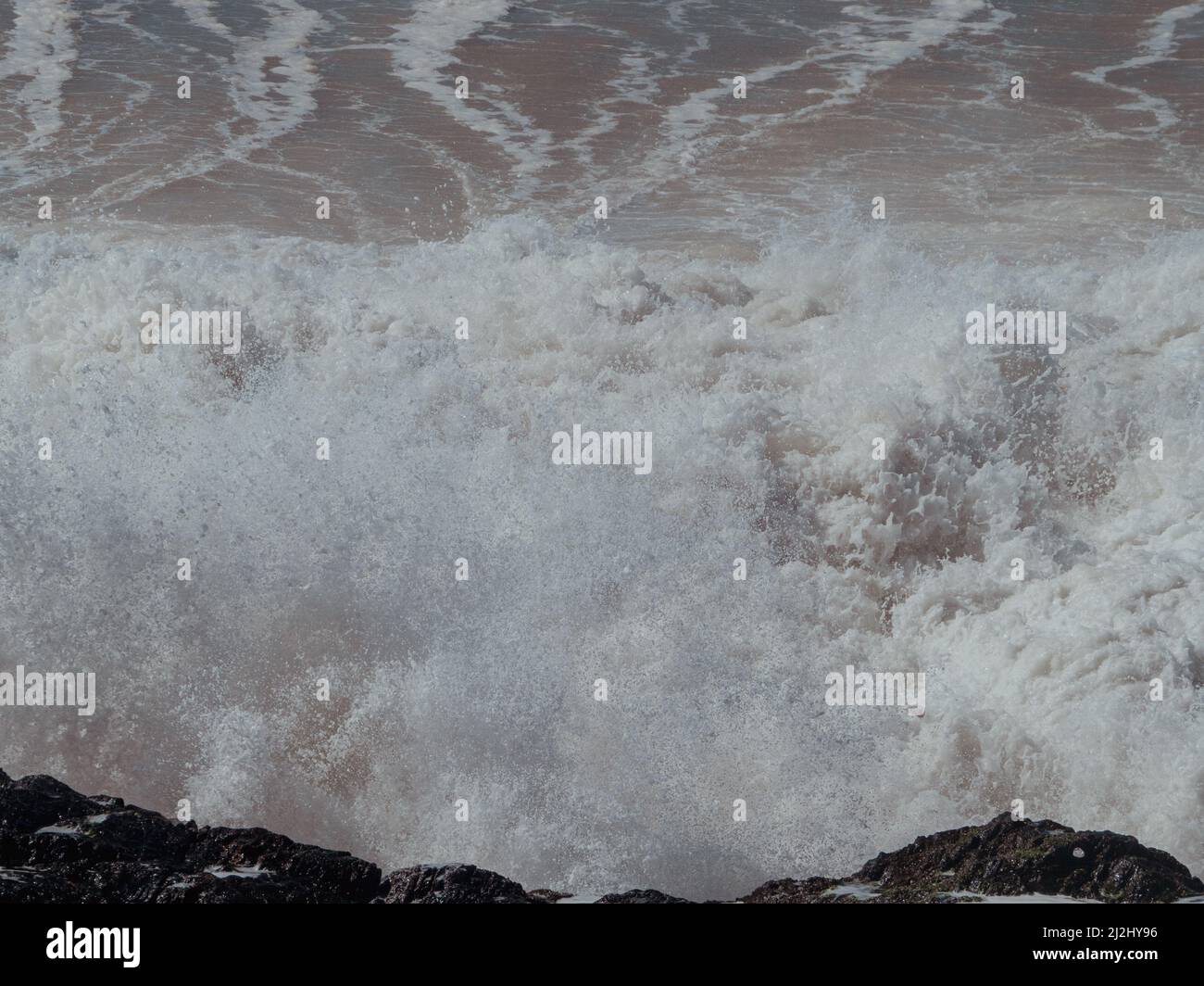 Ocean waves crashing on rocks on shore, splashing, sea spray up ...