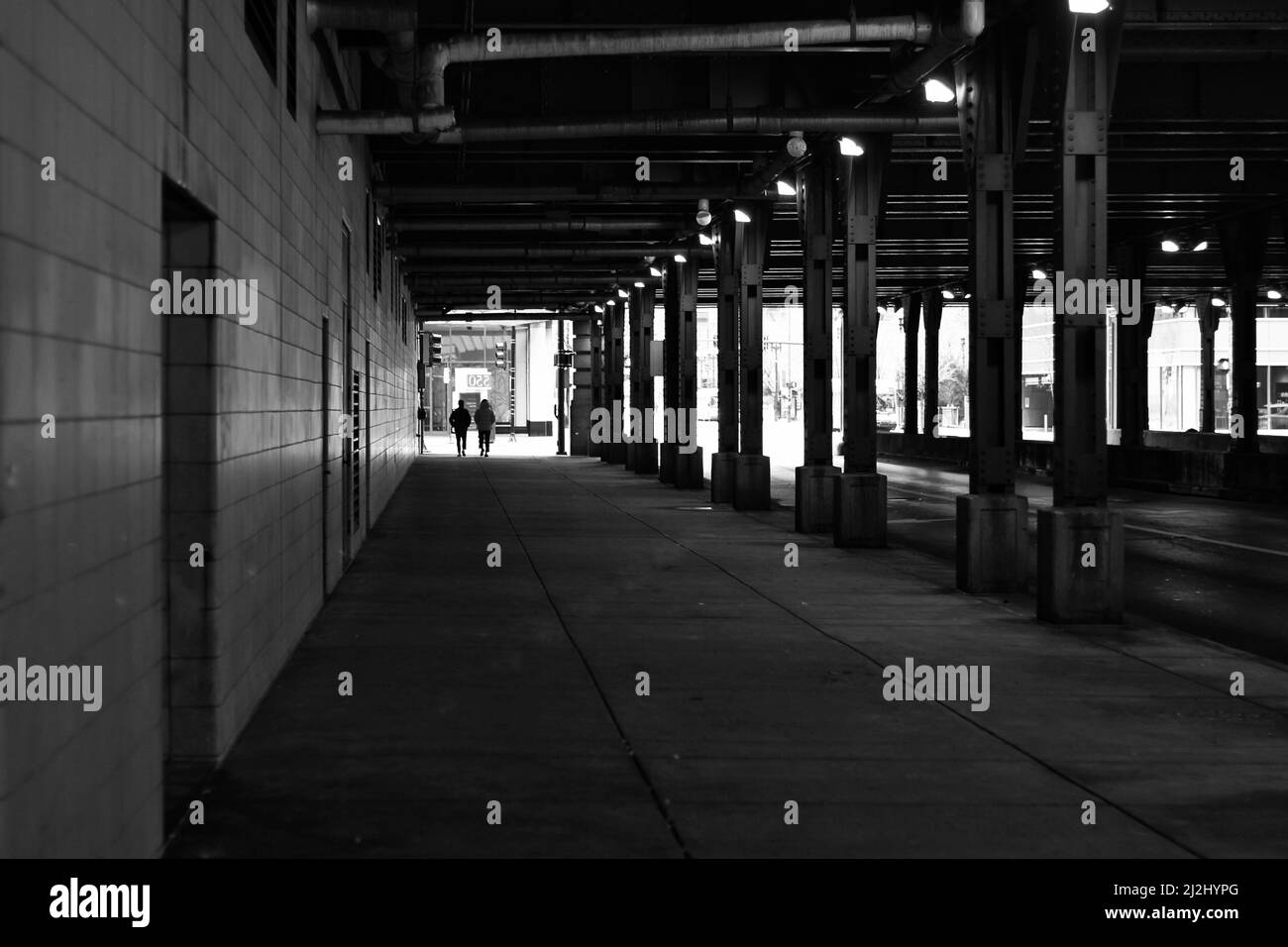 Two people walking under Chicago's downtown Ogilvie train station Stock ...