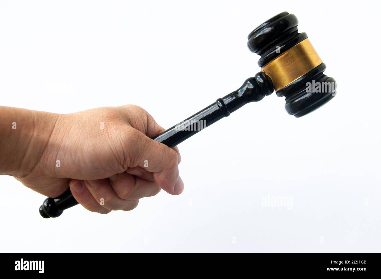 Hand holding Gavel with white background. Law and order concept Stock ...