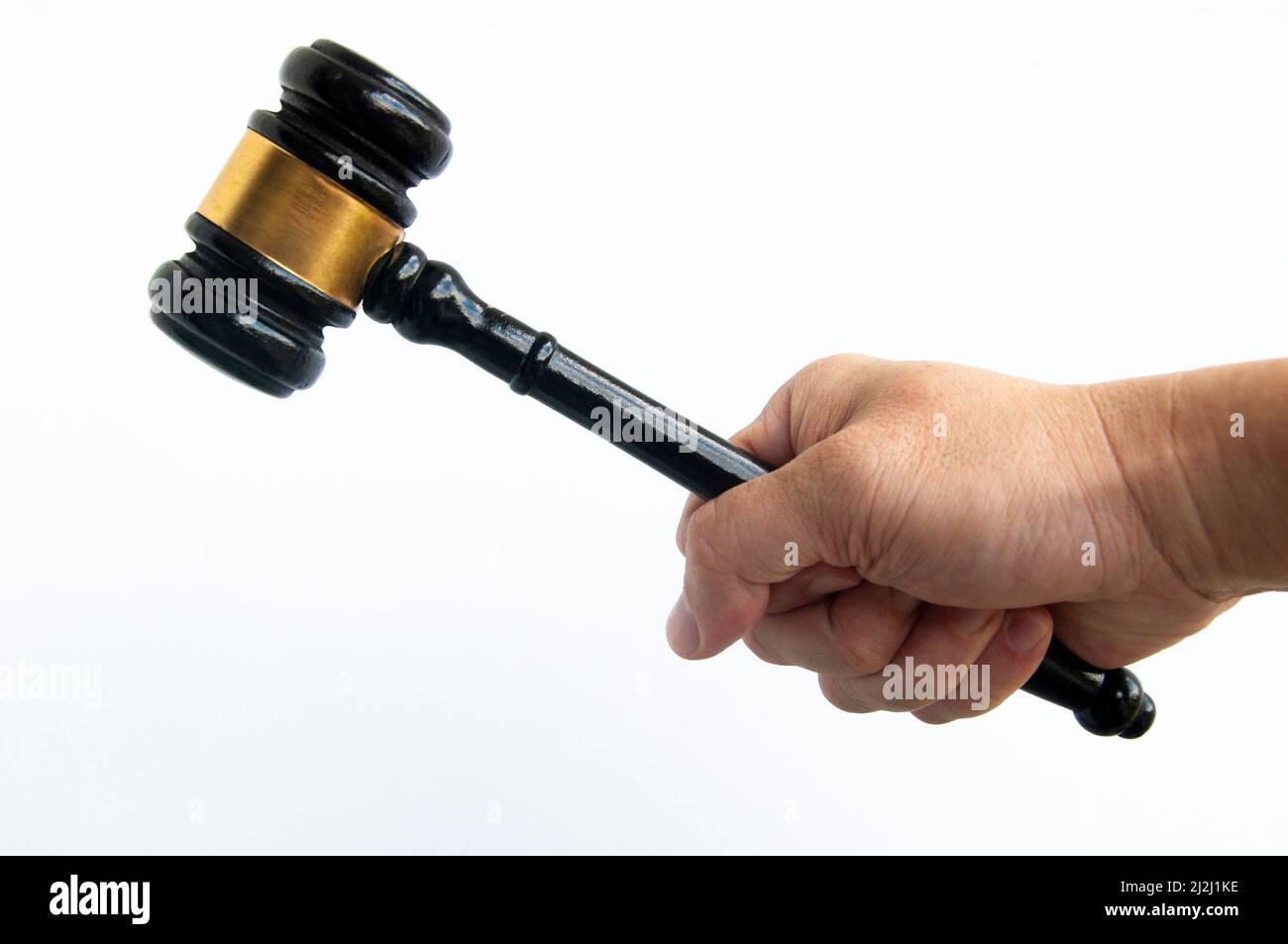 Hand holding Gavel with white background. Law and order concept Stock ...