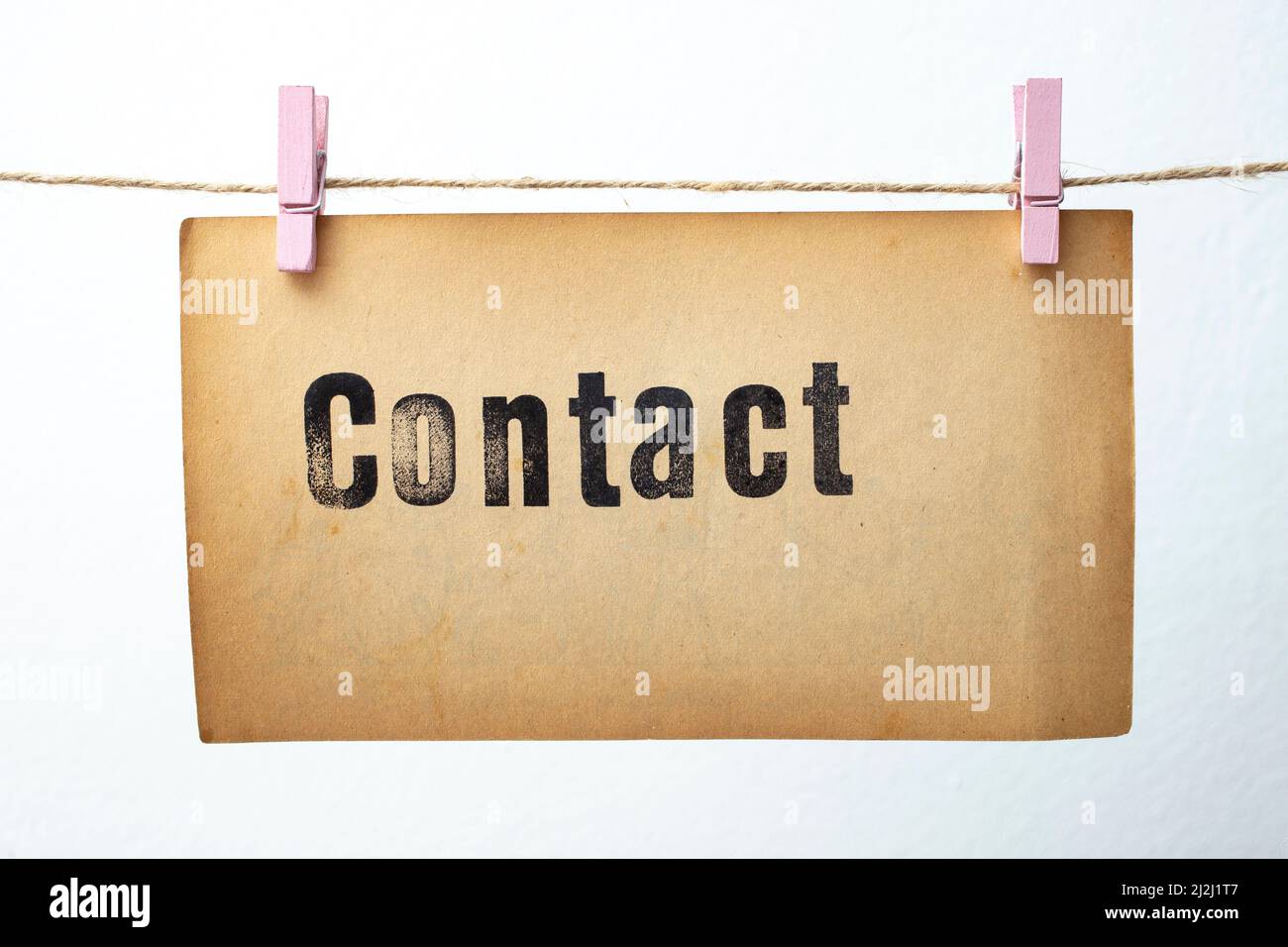 Contact written on vintage yellowed paper isolated on white Stock Photo ...