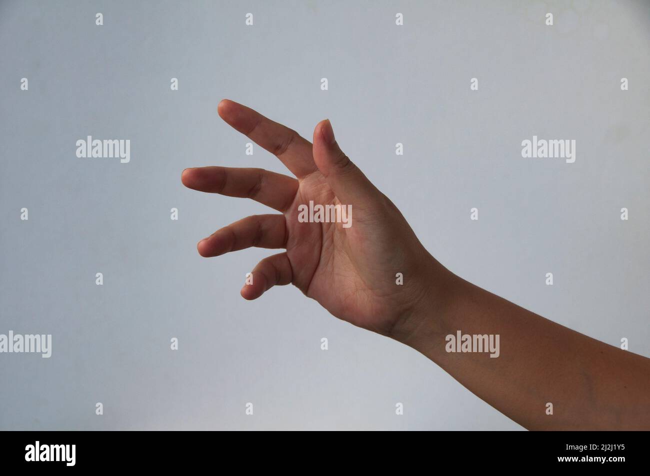 Women hand reaching out for help with white background Stock Photo - Alamy