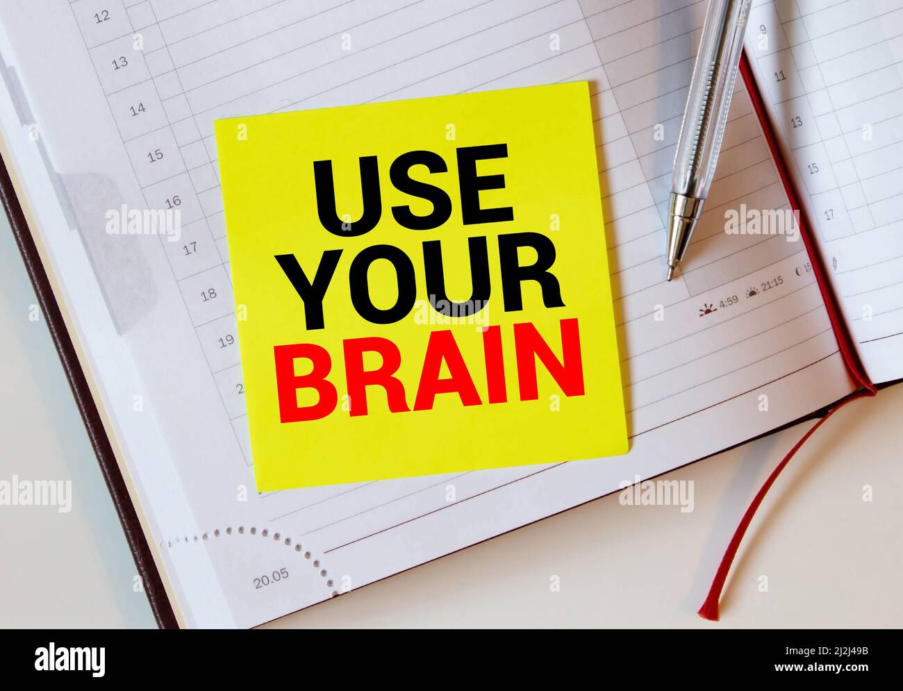 The phrase Use Your Brain in blue text on an index card pinned to a ...