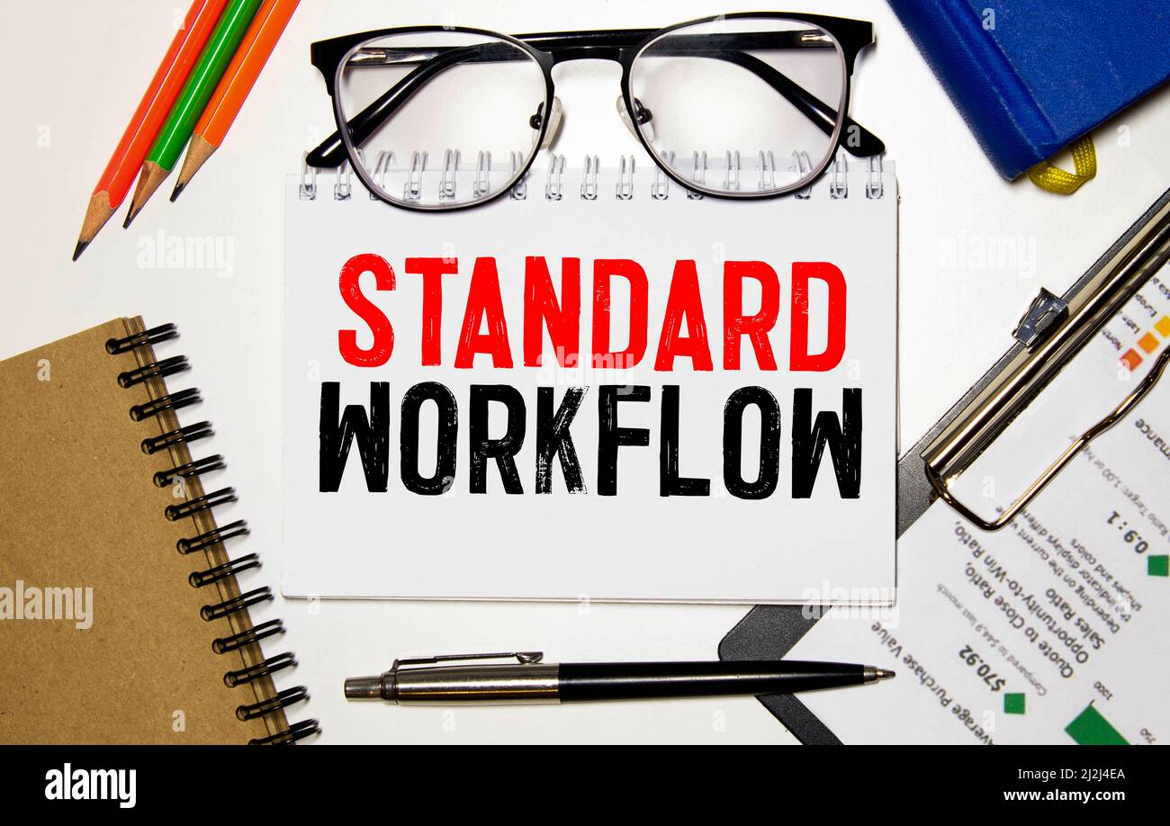 STANDARDS man hand notebook and other office equipment such as computer ...