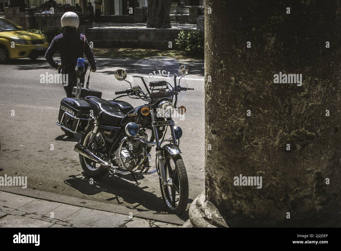 An old custom police bike parked in the street. Lifan LF125-7 Stock ...