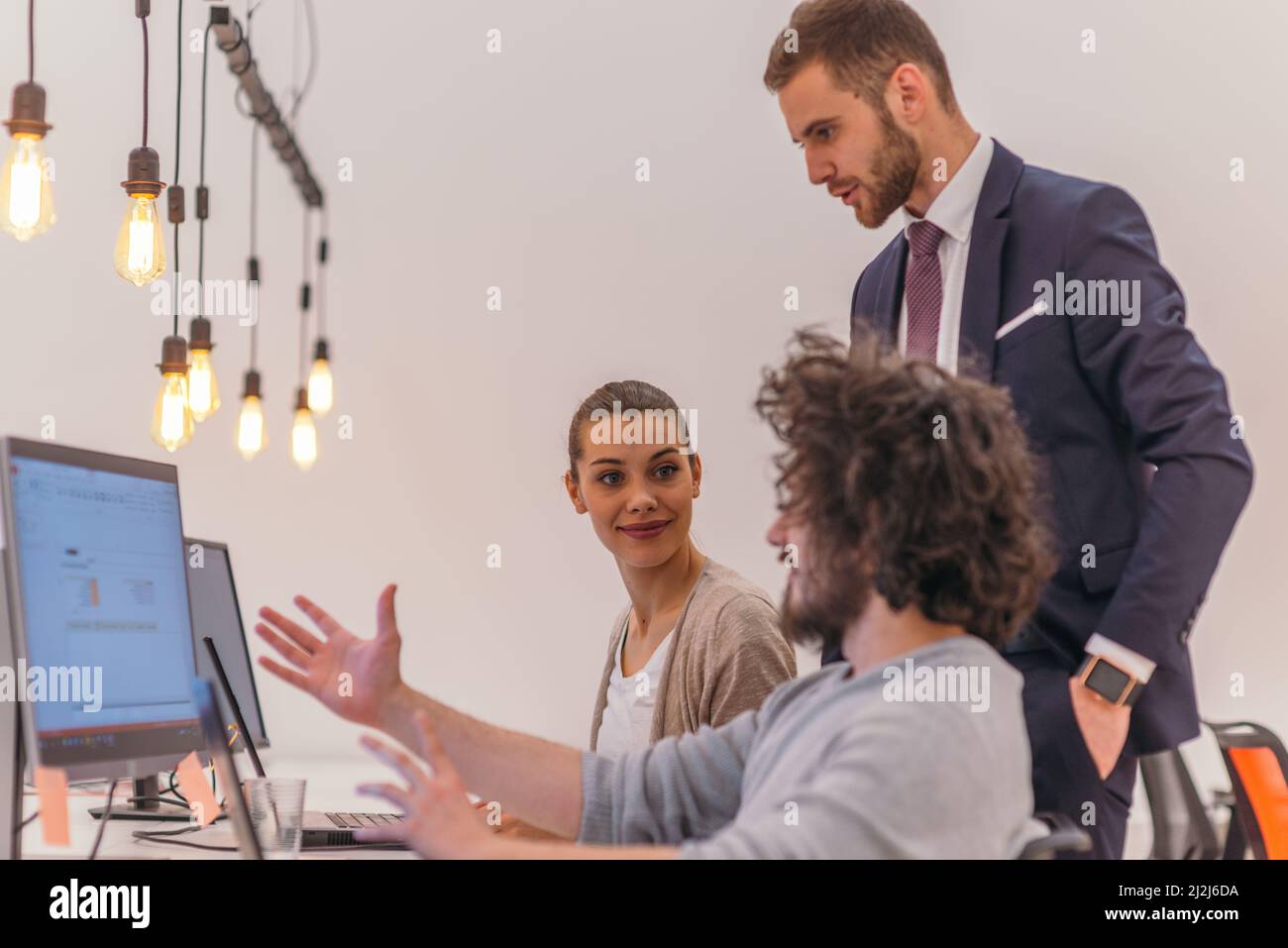 Manager overseeing his employees beautiful blonde and a coworker with ...