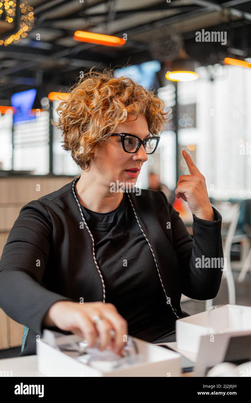 Amazing and beautiful business woman is explaining the products Stock ...