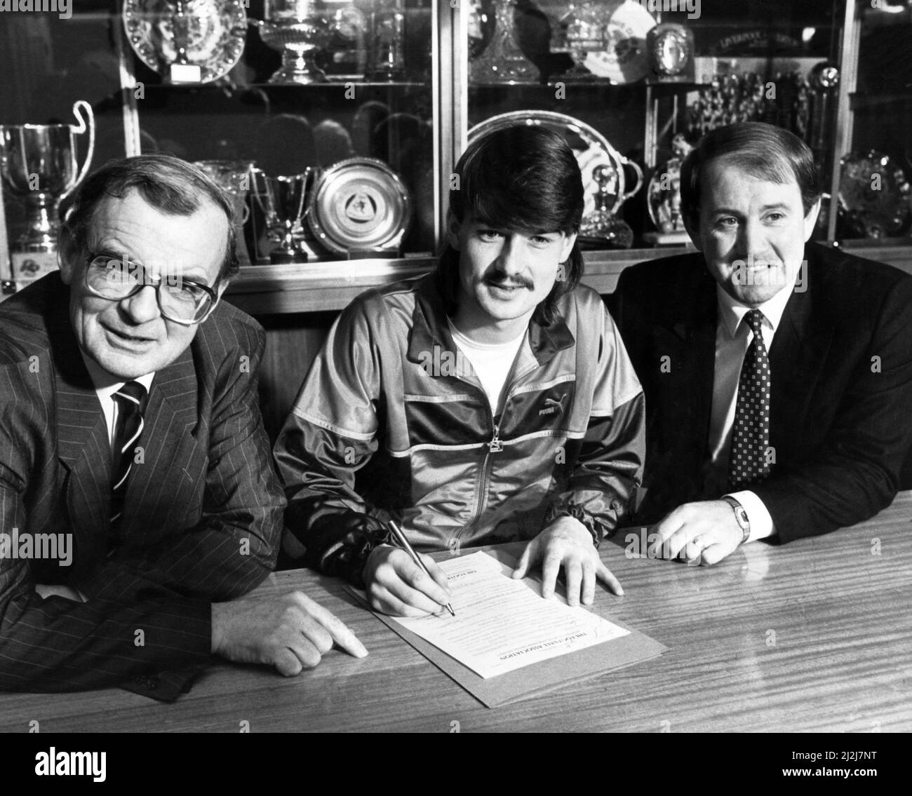Footballer Ian Snodin pictured signing for Everton watched by manager ...
