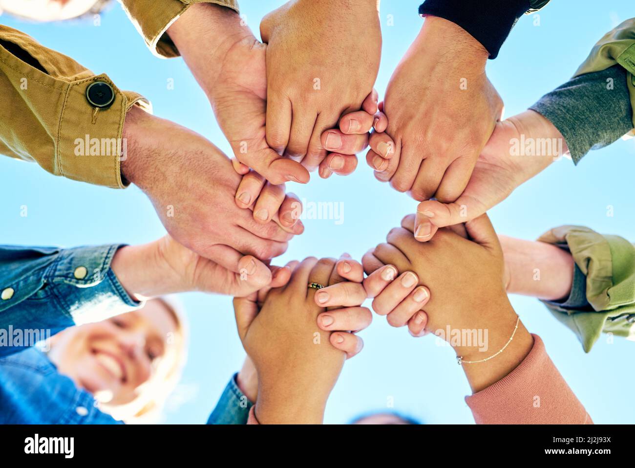 The unified group. Shot of a group of young students enjoying the day ...