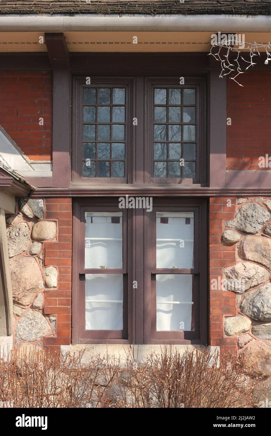 Vintage wooden windows on a charming rustic stone cottage Stock Photo ...