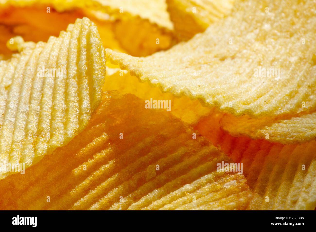 Potato Chips Close-Up. Fast Food. Macro Food background Stock Photo - Alamy