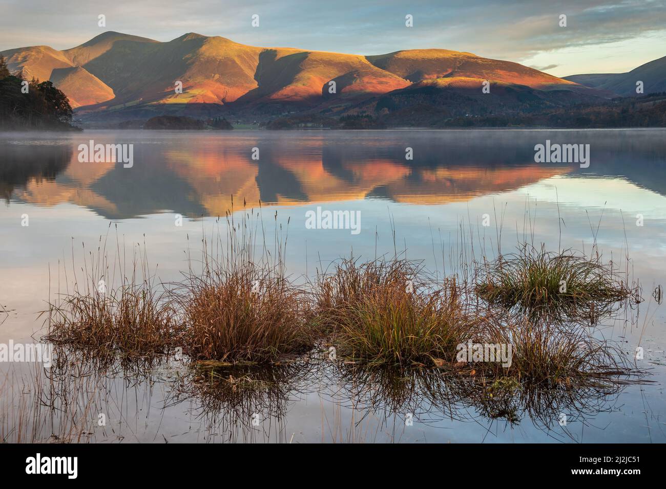 Epic Autumn sunrise landscape image looking from Manesty Park in Lake ...