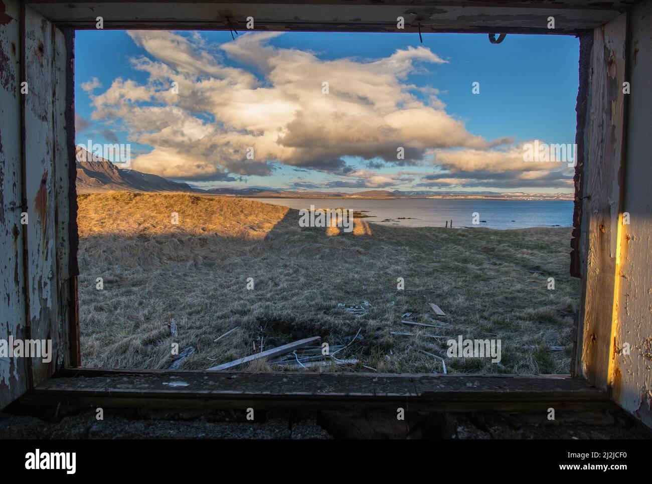 A beautiful Icelandic landscape seen through an old window Stock Photo ...