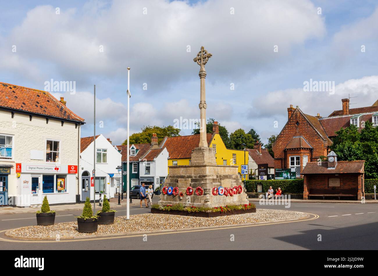 The war memorial with poppy wreaths in the market square of Holt, a ...
