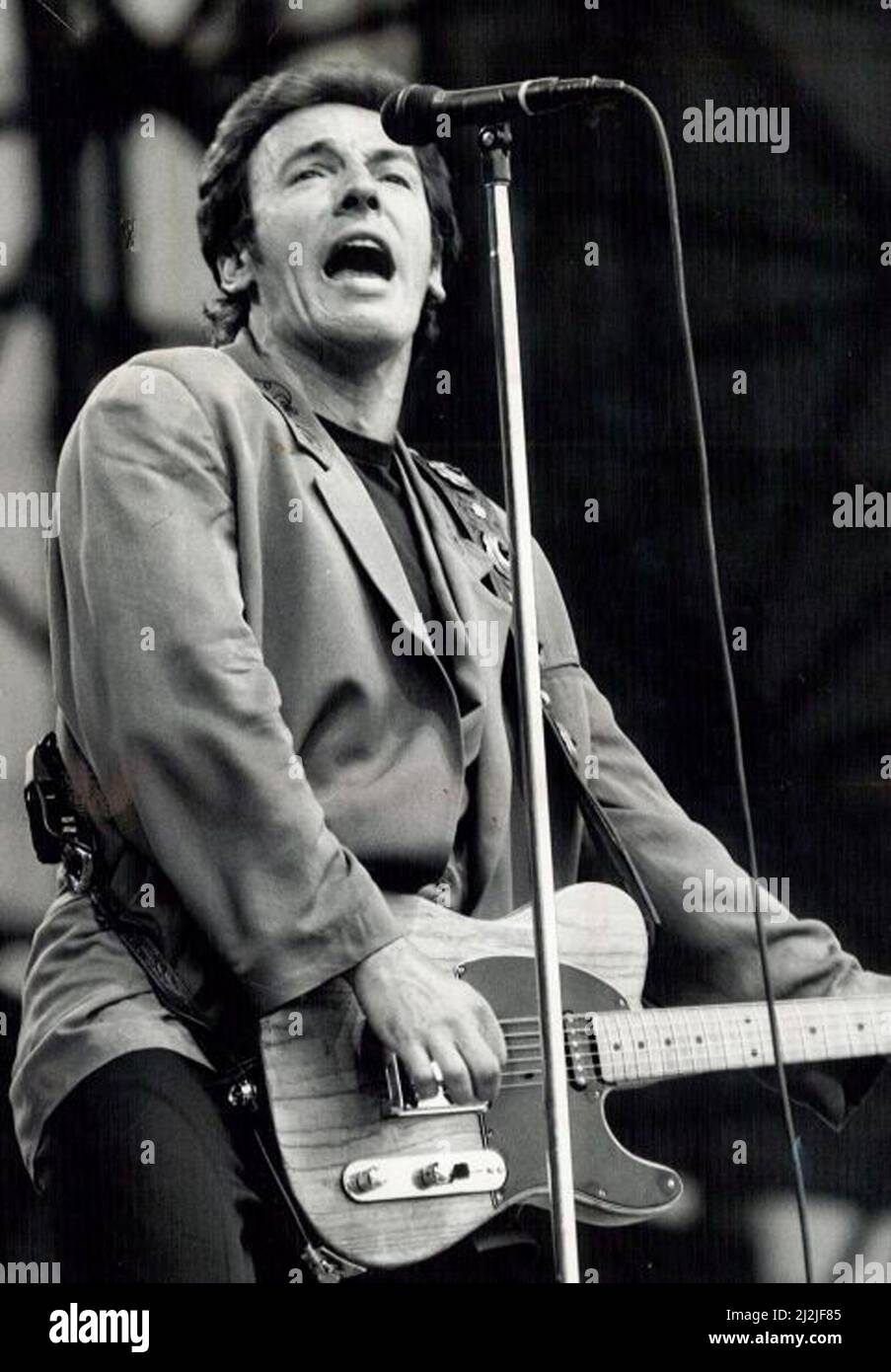 Bruce Springsteen performing on stage during a concert at Villa Park ...